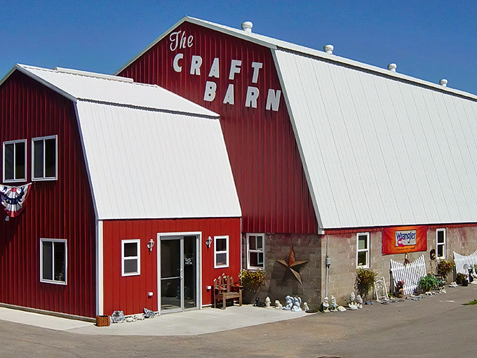 The Craft Barn's crimson exterior stands tall against the Wisconsin sky like a beacon for creativity-seekers. Adirondack chairs invite weary shoppers to rest their bargain-hunting legs.