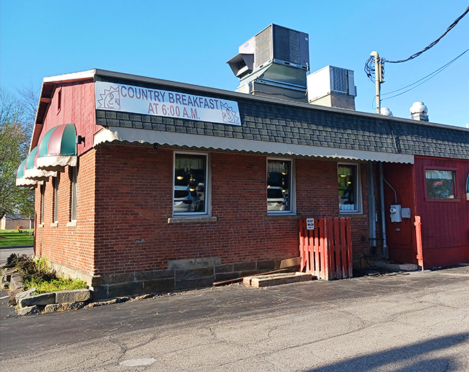 The bright red exterior of Circle Restaurant stands like a culinary lighthouse in Deerfield, promising "BREAKFAST ANYTIME" to hungry travelers seeking refuge.