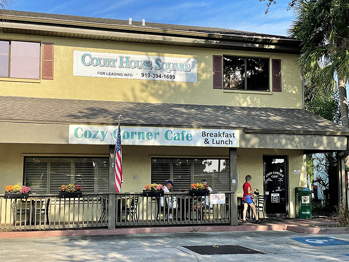 The yellow facade of Cozy Corner Cafe stands like a beacon of breakfast hope in Merritt Island's Court House Square, promising comfort food and conversation.