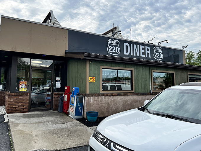 The humble roadside exterior of Route 220 Diner belies the culinary treasures within. Like finding a diamond in Pennsylvania's rolling hills.