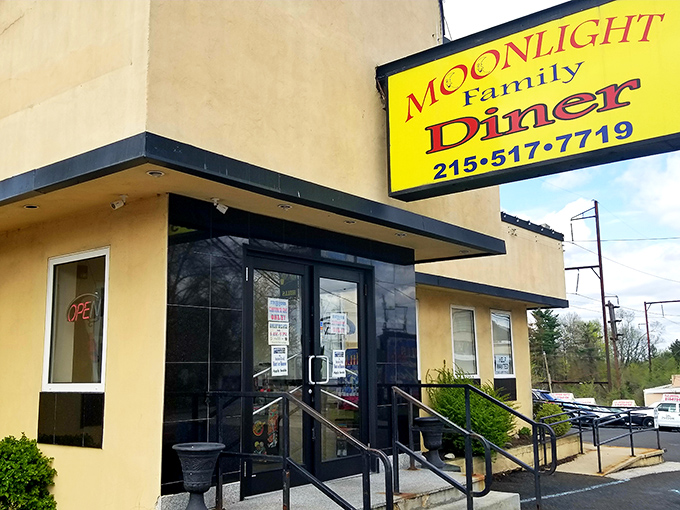 The unassuming tan exterior of Moonlight Diner stands like a breakfast beacon in Glenside, promising comfort food treasures within those humble walls.