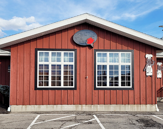 The rustic wooden exterior of Red Pig Inn welcomes hungry travelers like an old friend who happens to make killer barbecue.