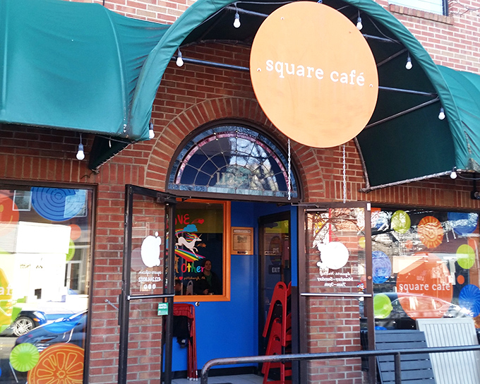 The bright orange sign and blue door of Square Cafe stand out like a breakfast beacon on Pittsburgh's East End, promising pancake perfection within.