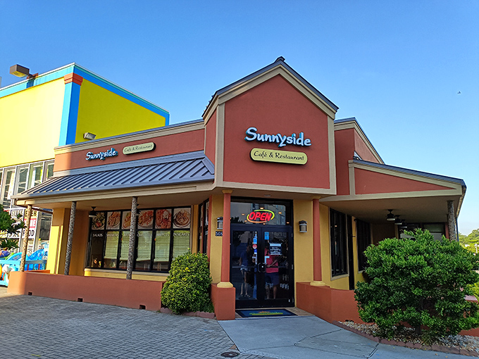 The coral and yellow exterior of Sunnyside Cafe stands like a beacon of breakfast hope among Virginia Beach's commercial landscape &ndash; unassuming yet irresistible.