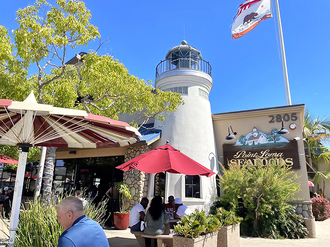 The iconic lighthouse-inspired architecture of Point Loma Seafoods stands as a beacon for seafood lovers, promising maritime delights under the perfect San Diego sky.