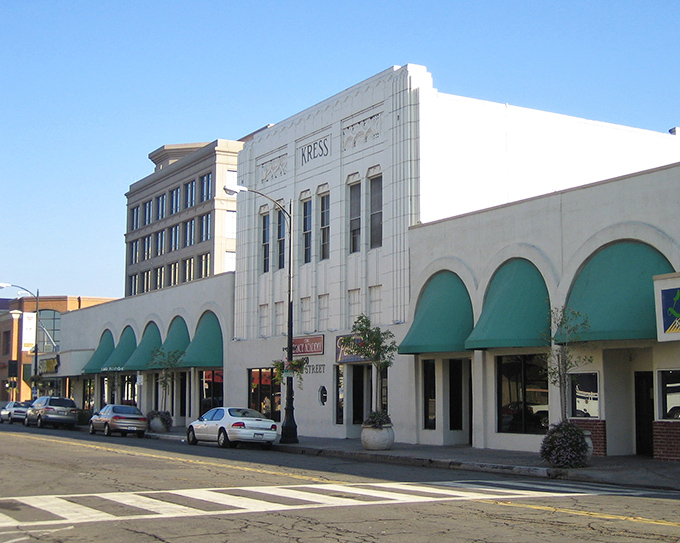 Downtown Modesto's historic buildings stand as a testament to the city's architectural heritage, with distinctive green awnings adding a touch of small-town charm.