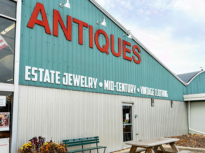 The mint-green beacon of vintage treasures stands proudly along Blue Star Highway, promising adventures through time rather than just shopping.