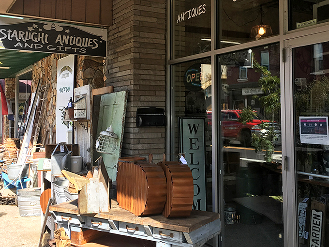 The storefront beckons with rustic charm &ndash; vintage treasures spill onto the sidewalk like the shop couldn't contain its own excitement.