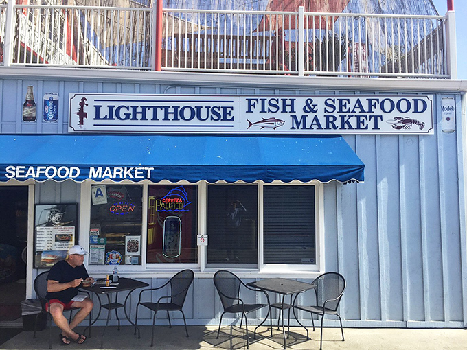 The iconic blue awning beckons seafood lovers like a maritime siren song. This unassuming storefront houses treasures fresher than your excuses for not visiting sooner.