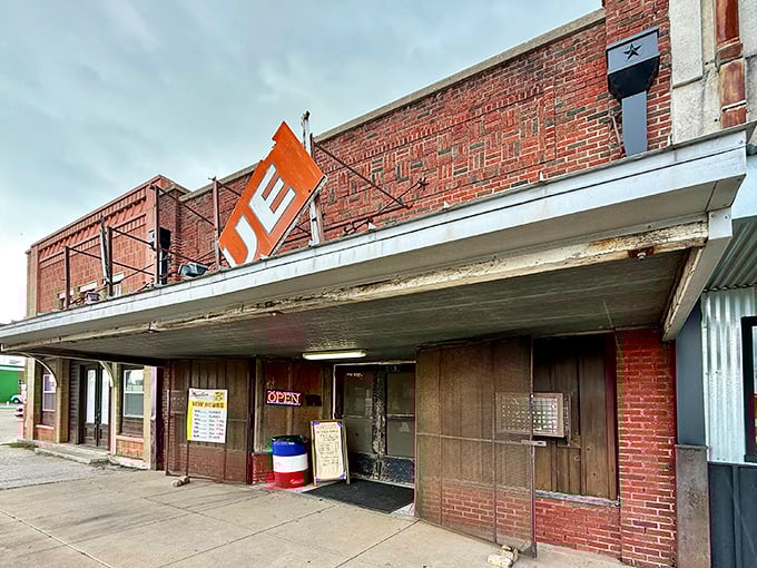 The unassuming brick exterior of Louie Mueller Barbecue &ndash; where culinary pilgrimages begin and diets go to die gloriously.