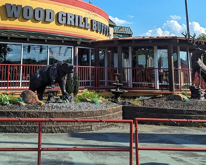 The majestic deer statue stands guard outside Wood Grill Buffet like a woodland bouncer saying, "Yes, there's plenty of food inside."