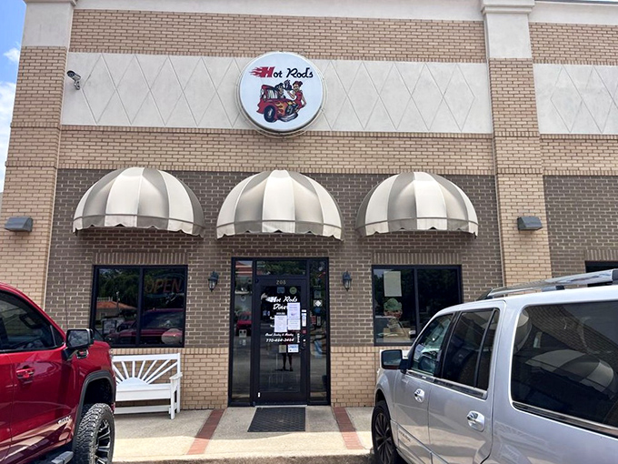 The classic brick exterior with striped awnings isn't just a restaurant&mdash;it's a time machine disguised as a diner in Social Circle, Georgia.