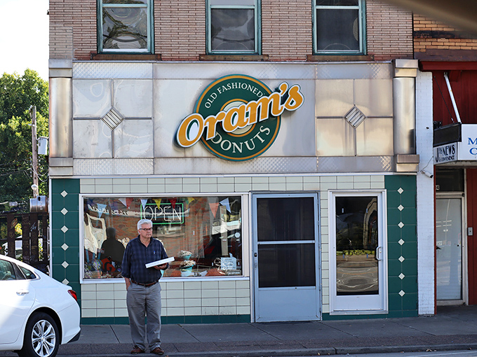 The classic storefront of Oram's Donut Shop stands proudly in Beaver Falls, a beacon of sweet hope for early risers and donut enthusiasts alike.