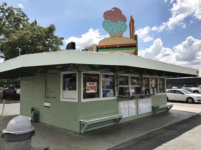 The mint green time capsule topped with those iconic burger and ice cream signs is like a beacon calling to your inner child and hungry adult self simultaneously.
