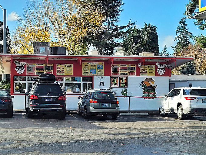 The red and white facade of Mike's Drive-In stands like a time capsule of Americana, beckoning hungry travelers with promises of burgers and bliss.