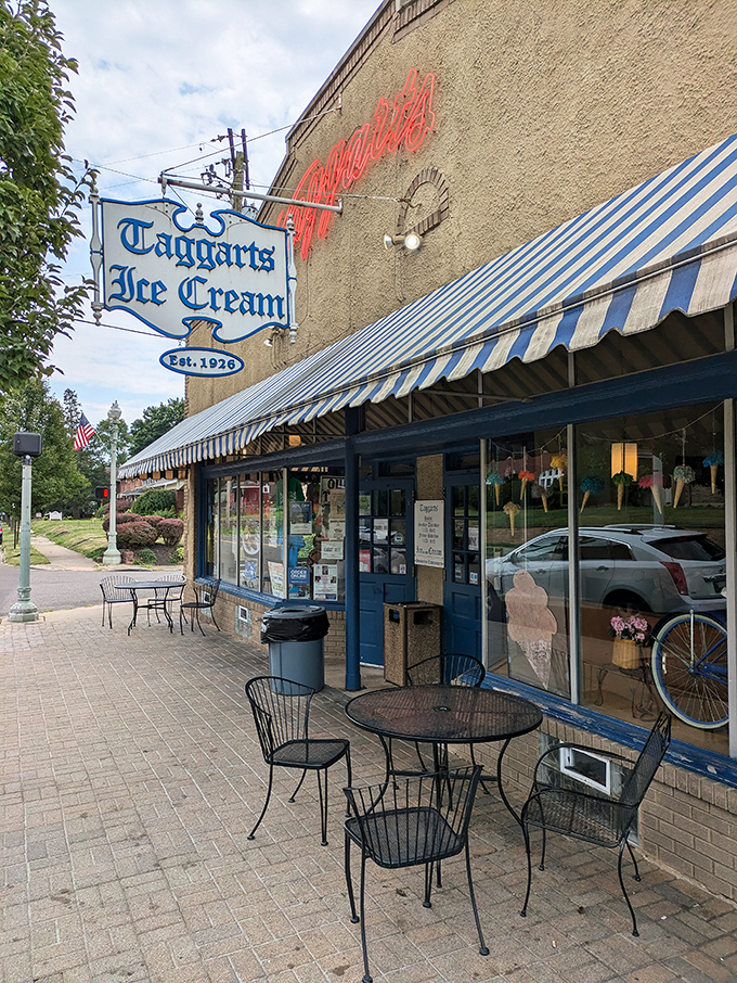 The blue and white striped awnings of Taggarts Ice Cream beckon like a sweet siren call, promising frozen treasures within this Canton landmark.