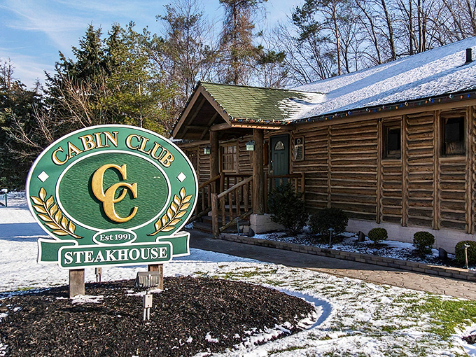 The rustic log cabin exterior of Cabin Club isn't just charming&mdash;it's a promise of the cozy, wood-scented culinary adventure waiting inside.