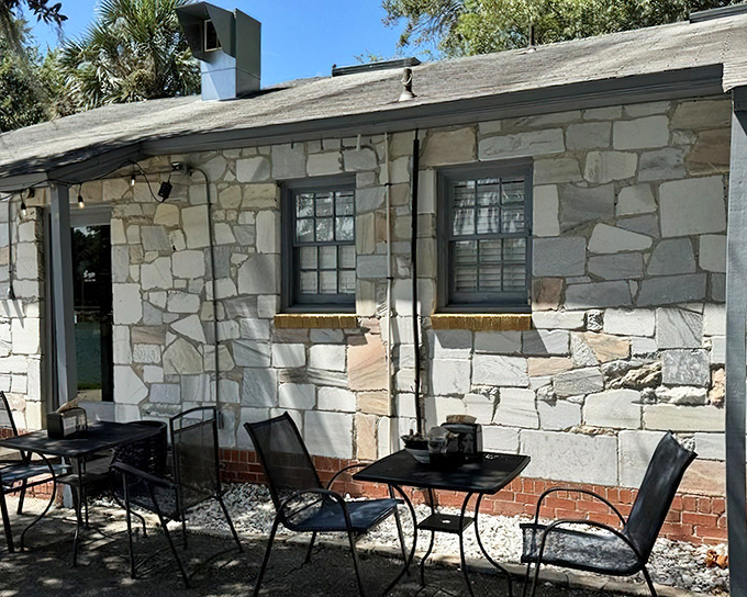 Stone cottage charm meets lakeside serenity at Leon's, where Spanish moss and Florida sunshine create the perfect backdrop for culinary magic.