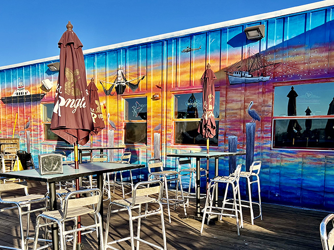 The sunset mural at Singleton's isn't just decoration&mdash;it's a promise of the colorful seafood experience waiting inside this Jacksonville waterfront gem.