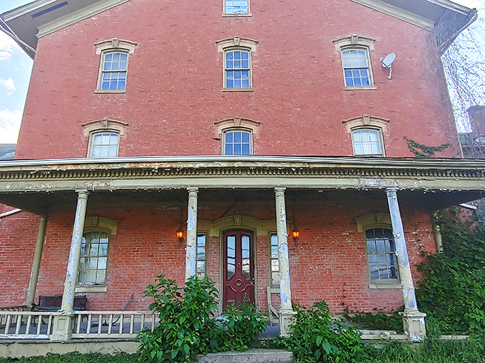 The imposing red brick facade stands like a Victorian novel come to life, its windows watching over Lancaster with century-old stories to tell.