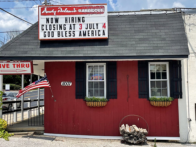 The giant pink pig on the roof isn't just decoration &ndash; it's a beacon of barbecue hope guiding hungry travelers to this rustic red barn-like paradise.