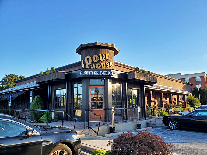 The Pour House stands like a rustic beacon of culinary promise, its wooden facade and octagonal entrance saying "yes, the food inside is as characterful as our architecture."
