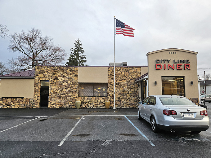 Stone facade, American flag, and that iconic red sign – City Line Diner stands like a delicious fortress of comfort food in Harrisburg.