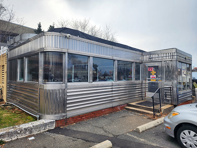 The gleaming stainless steel exterior of Frost Diner stands like a time capsule on wheels, promising comfort food and conversations that matter.