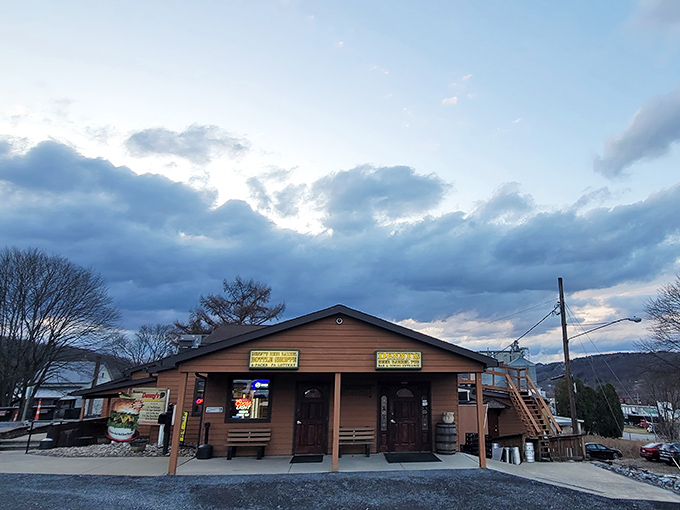 The unassuming wood-sided exterior of Denny's Beer Barrel Pub doesn't hint at the colossal challenges waiting inside, though that burger sign offers a pretty good clue.