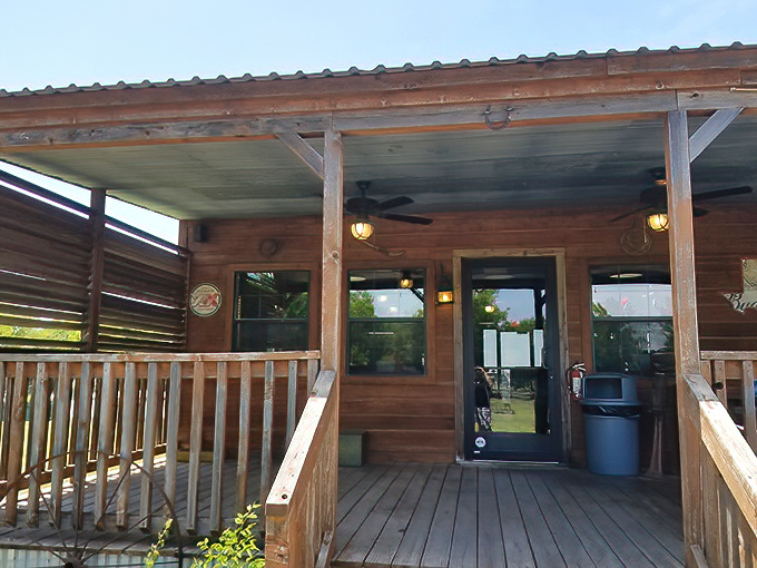 The rustic wooden exterior of Good Luck Grill beckons like an old friend, promising comfort food treasures beneath that corrugated metal roof and welcoming porch.