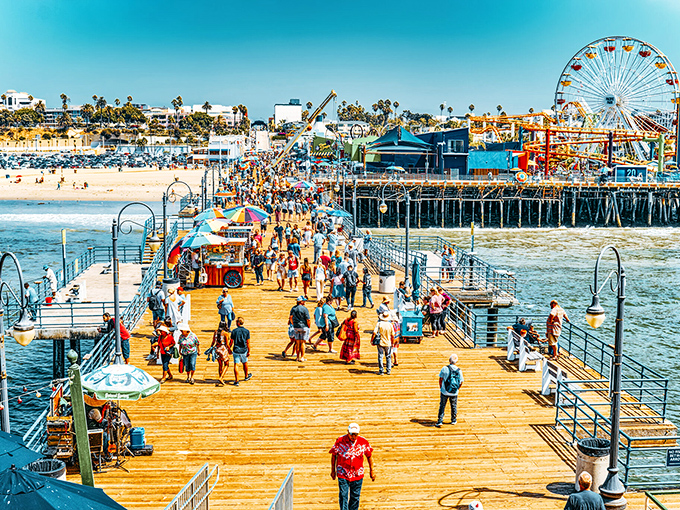 Sun-soaked boardwalk dreams come to life where wooden planks meet Pacific blue, creating California's perfect postcard moment at Santa Monica Pier.