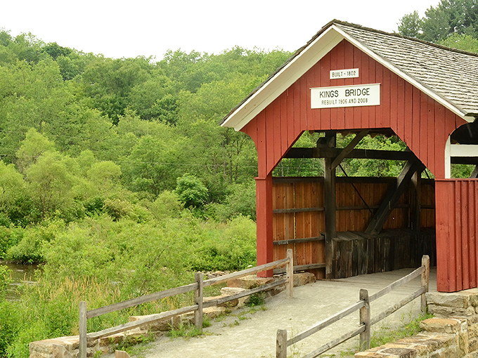The classic red exterior of King's Bridge stands in stark contrast to the lush Pennsylvania greenery, like a crimson bookmark in nature's novel.