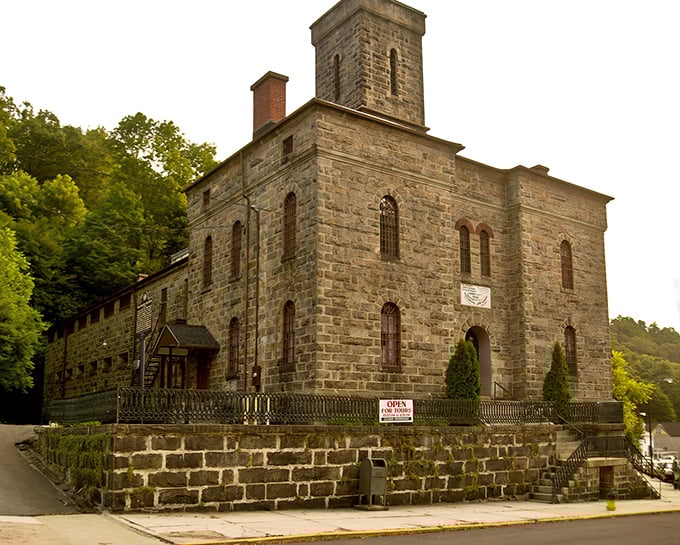 The imposing stone facade of the Old Jail Museum looks like it was designed by someone who really, really didn't want overnight guests to extend their stay.