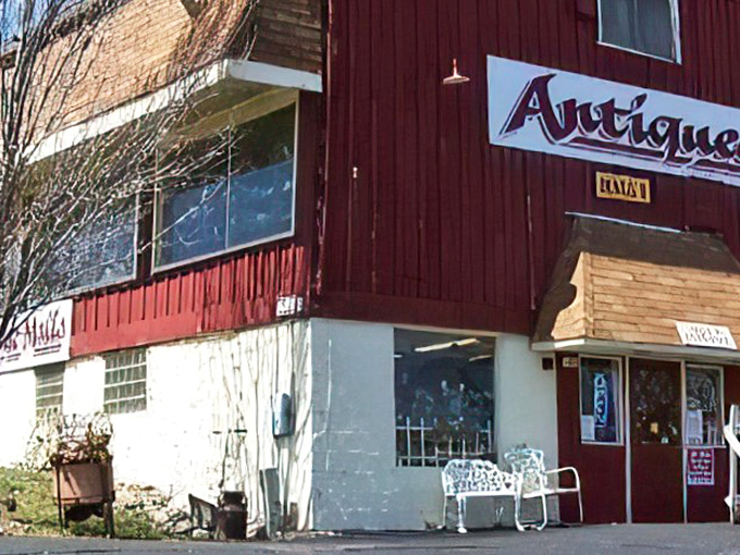 The iconic red barn exterior of Volo Antique Malls stands as a beacon to treasure hunters, promising adventures in nostalgia just beyond those doors.