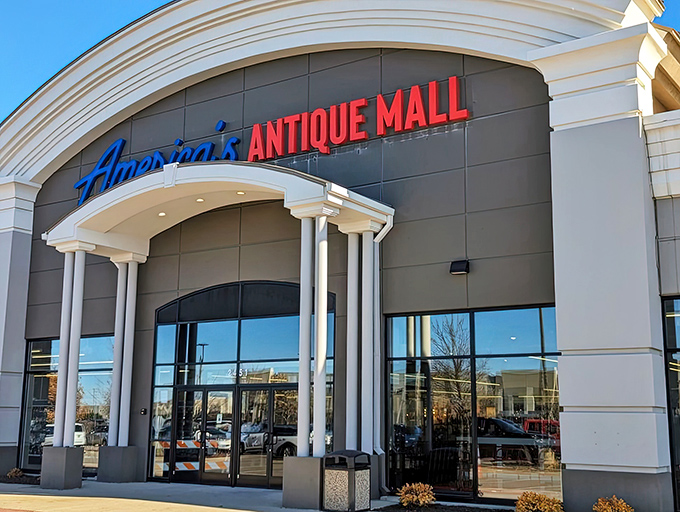 The grand entrance to America's Antique Mall beckons with retro charm and the promise of treasures waiting just beyond those glass doors.