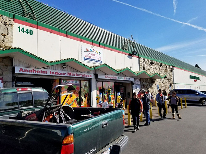The unassuming exterior of Anaheim Marketplace hides a world of wonders within. Green trim and stone accents hint at the cultural treasures awaiting discovery inside.