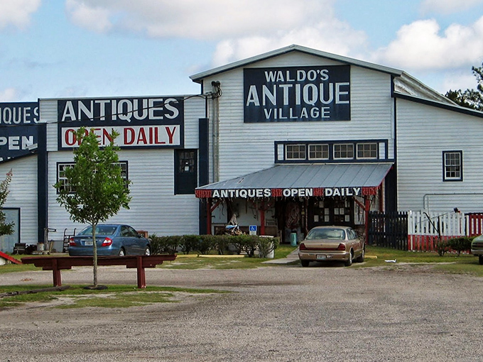 The iconic white buildings of Waldo's Antique Village stand like beacons for treasure hunters, promising daily doses of nostalgia and unexpected finds.