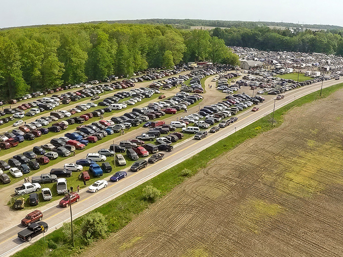 The aerial view doesn't lie—this isn't just a flea market, it's a small civilization dedicated to the art of the deal. Michigan's treasure hunters arrive by the hundreds.