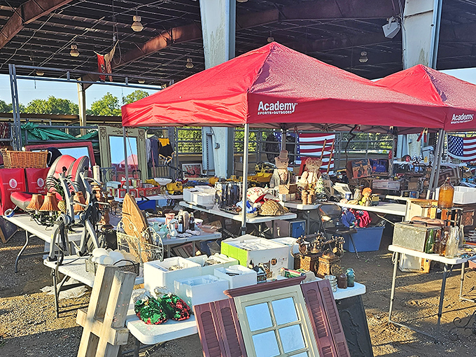 The treasure hunt begins! Red canopies shelter an eclectic array of vintage finds, from wooden windows to holiday decorations, all waiting for their forever homes.