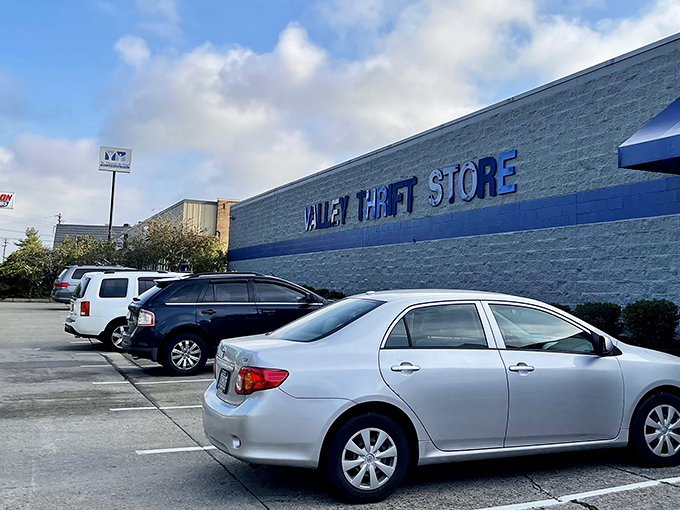Valley Thrift Store's iconic clock tower and red-topped building stand like a beacon for bargain hunters. The blue awnings practically whisper "treasures await inside!"