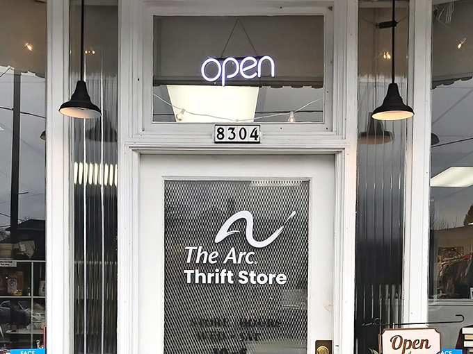 The welcoming storefront of The Arc Thrift Store beckons with its glowing neon sign&mdash;like a lighthouse guiding bargain hunters to treasure-filled shores.