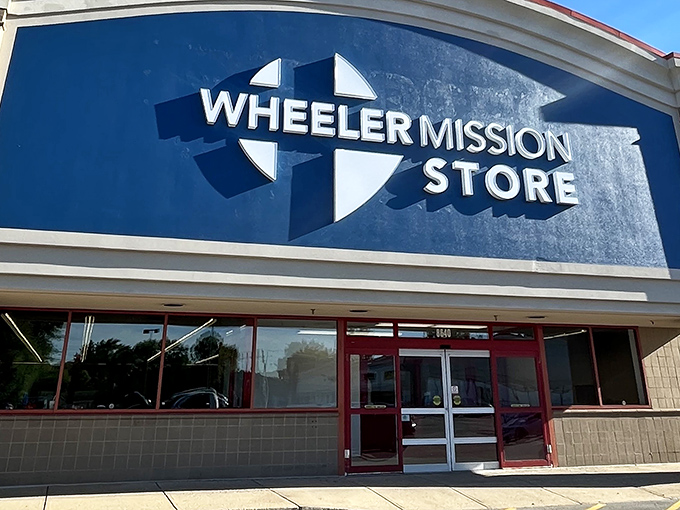 The iconic blue and white Wheeler Mission Store facade stands as a beacon for bargain hunters across Indianapolis.