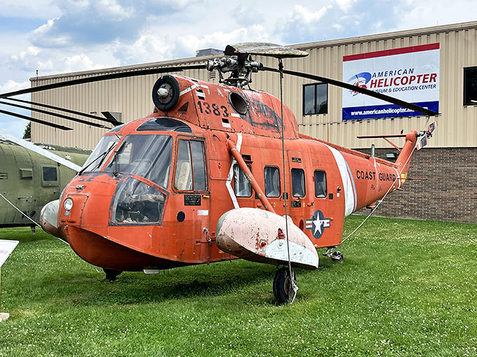 The iconic orange Coast Guard helicopter stands sentinel outside the museum, a vibrant reminder of countless daring rescues over churning seas.