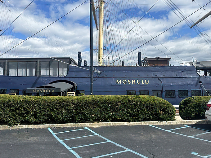 The mighty Moshulu in all her blue-hulled glory, standing sentinel at Penn's Landing like a maritime guardian that traded sailing the high seas for serving high cuisine.