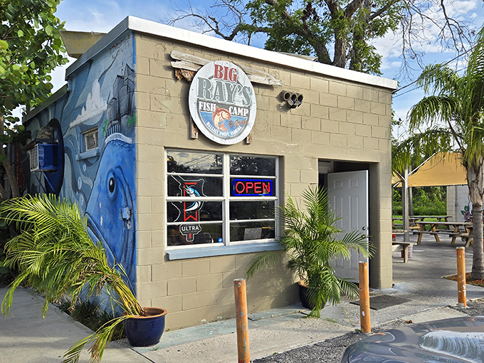 The little concrete block building that could! Big Ray's exterior mural tells you everything &ndash; this place takes fishing (and fish) seriously.