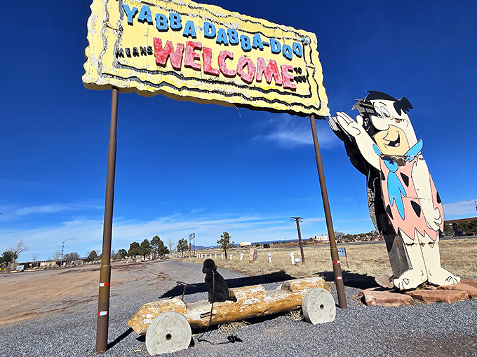 Fred Flintstone would feel right at home at this whimsical entrance, where prehistoric charm meets Route 66 kitsch in spectacular fashion.