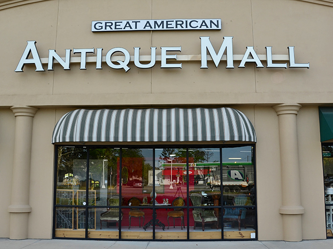 The storefront beckons with its classic striped awning &ndash; like a time portal disguised as a strip mall tenant. Treasure awaits!