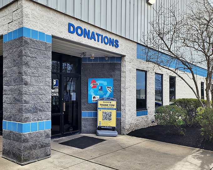The unassuming exterior of Goodwill Outlet in New Castle hides a universe of undiscovered treasures within its industrial walls.