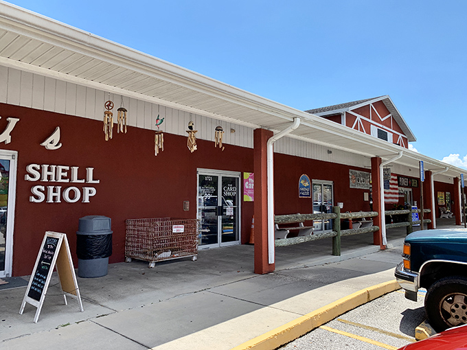 The Red Barn sprawls like a treasure-hunting kingdom, its distinctive red-trimmed roofline promising adventures within. Florida's ultimate "I didn't know I needed that" destination.