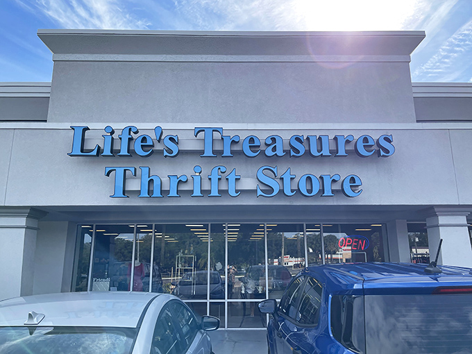 The bright blue signage of Life's Treasures stands out like a beacon for bargain hunters, promising adventures in affordable retail therapy. 